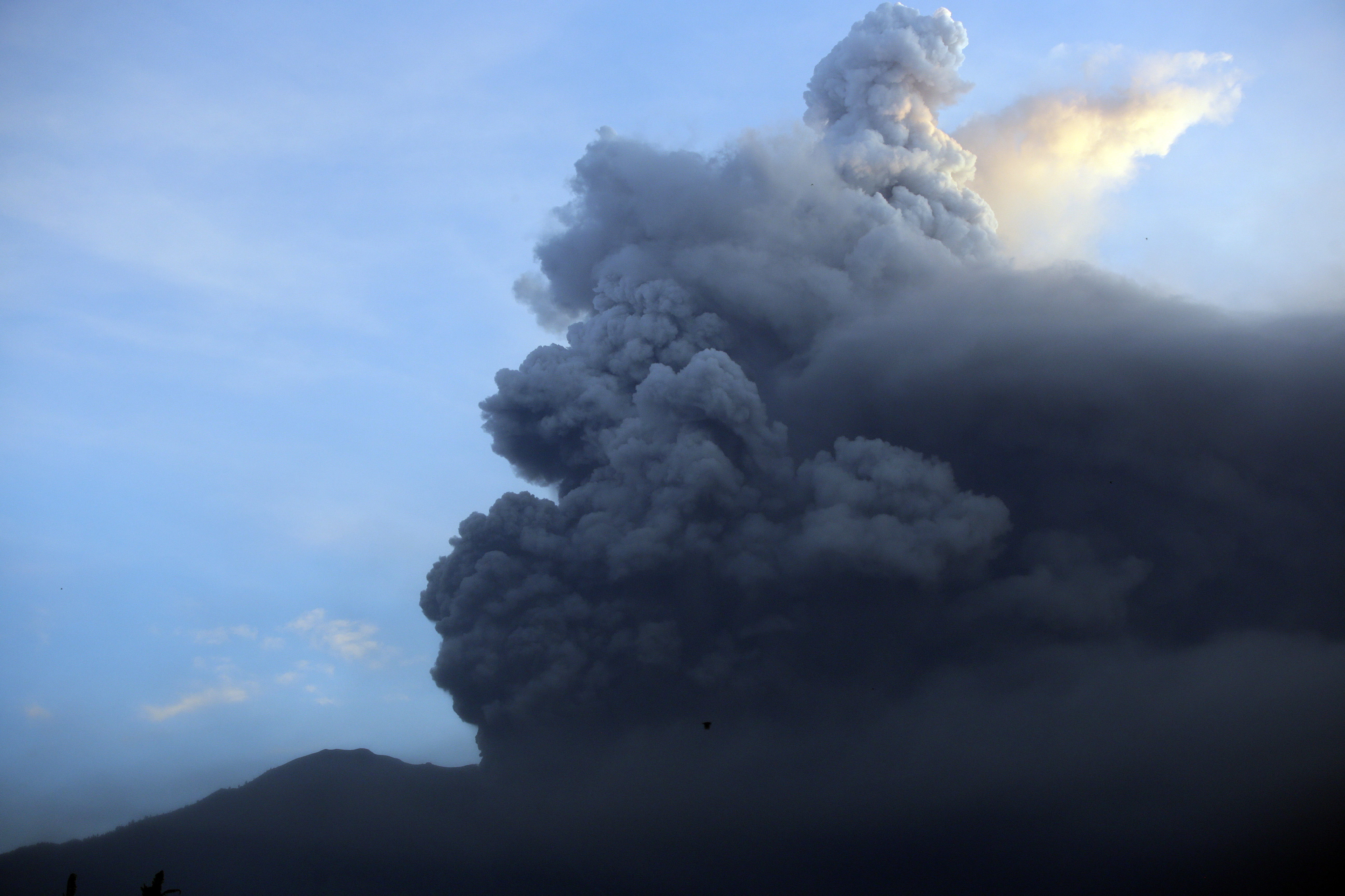Bali volcano shifts to magma eruptions, forcing evacuations and ...