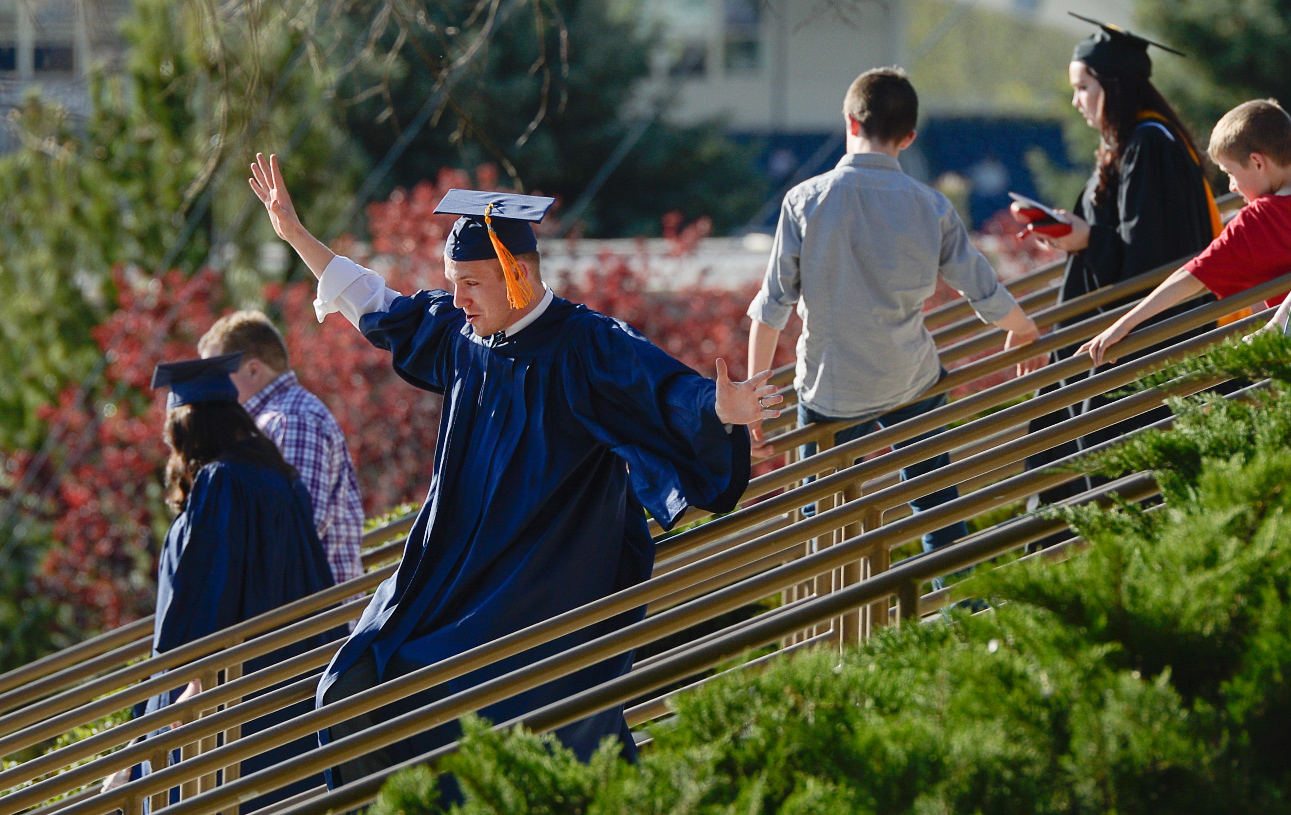 Mormon apostle tells graduating BYU students to ‘be a ray of light’ in ...